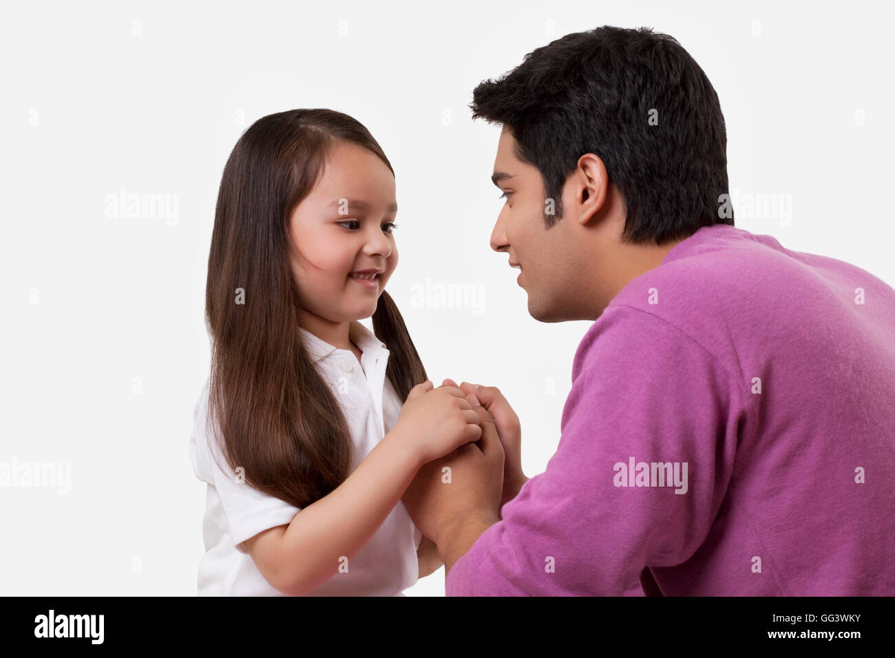 Father and daughter holding hands over white background Stock Photo - Alamy