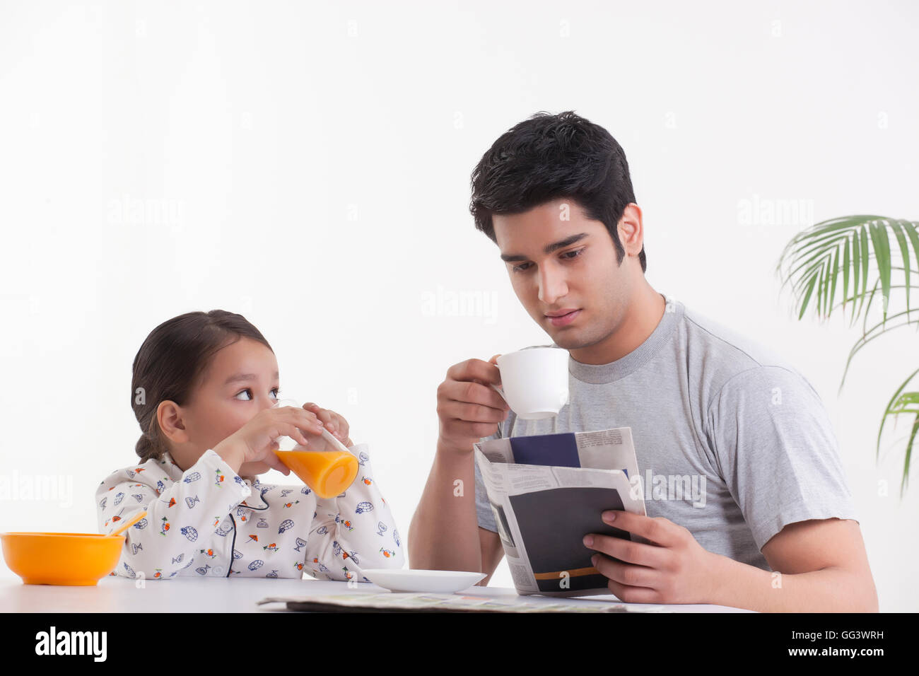 Daughter Looking Father Reading Newspaper High Resolution Stock ...