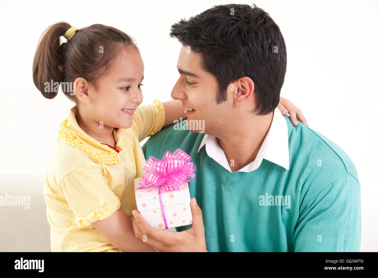 Father giving gift to his daughter Stock Photo - Alamy