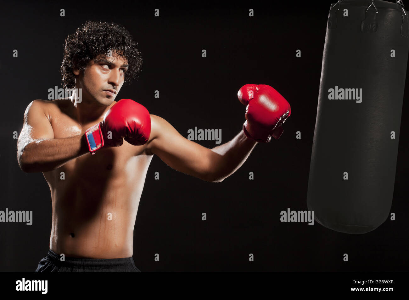 Man hitting black heavy back Stock Photo - Alamy