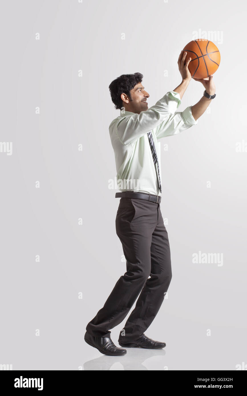 Basketball player about to throw a ball Stock Photo - Alamy