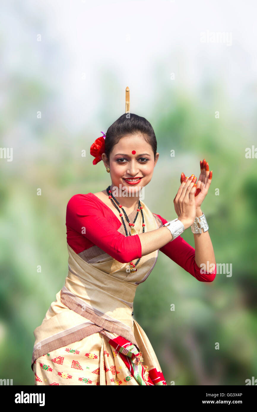 Woman performing Bihu dance Stock Photo - Alamy