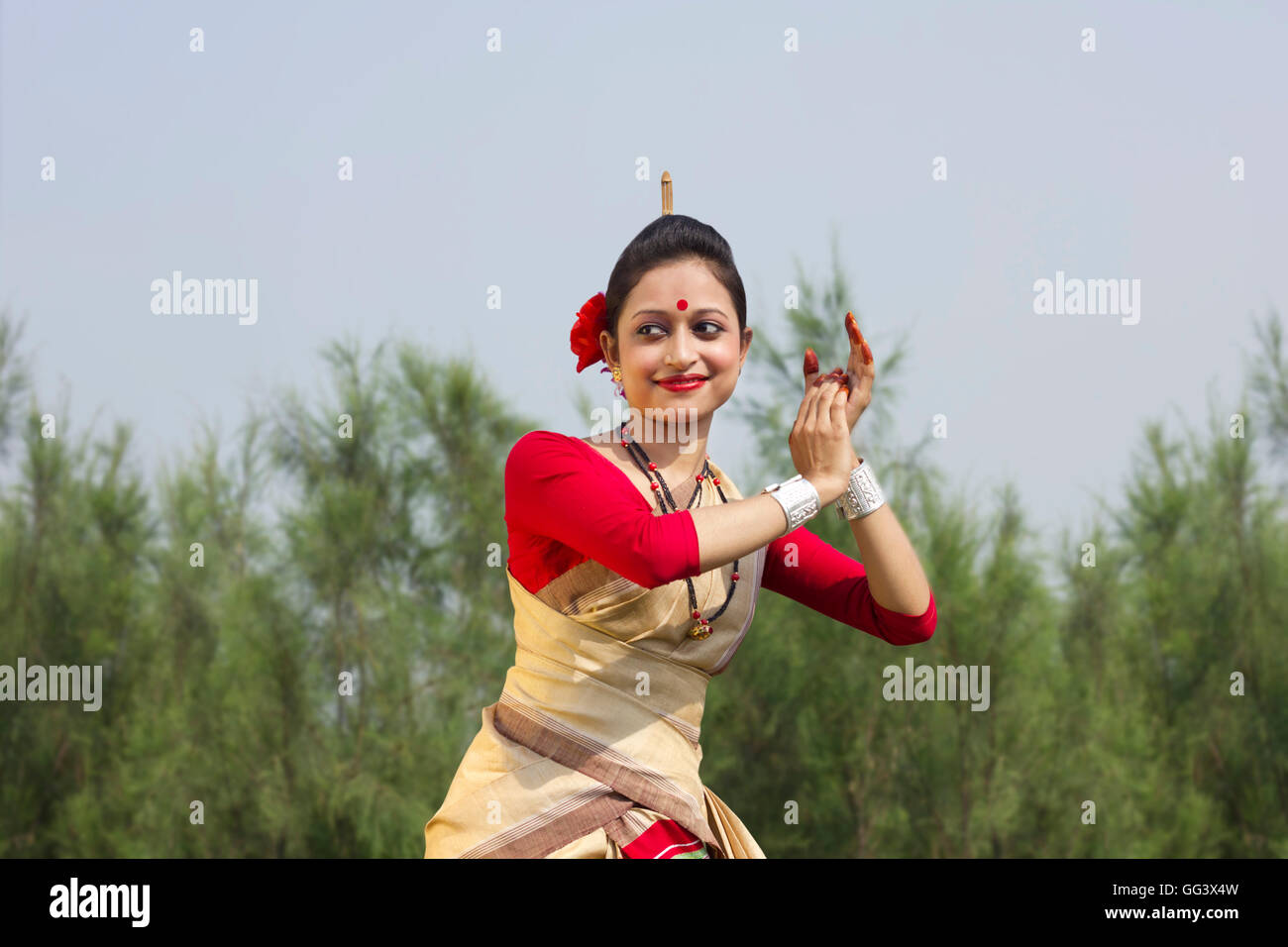 Woman performing Bihu dance Stock Photo - Alamy