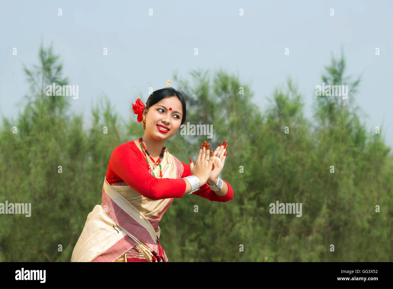 Woman performing Bihu dance Stock Photo - Alamy