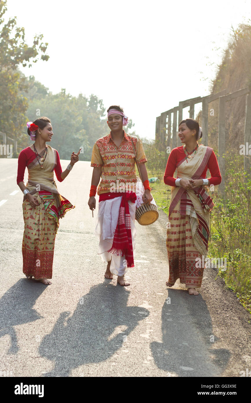 Bihu dancers walking together Stock Photo - Alamy