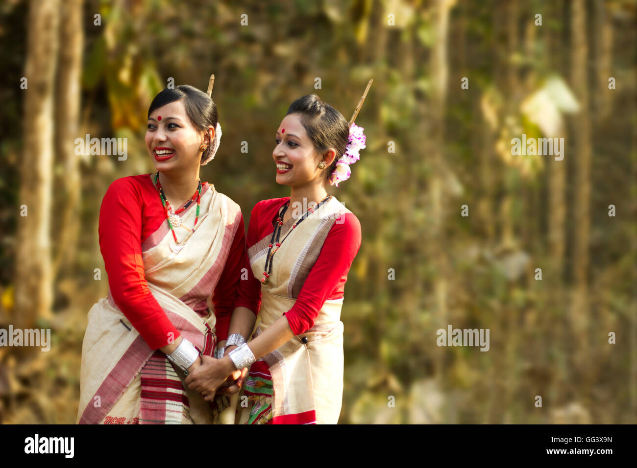 Bihu women dancers smiling Stock Photo - Alamy