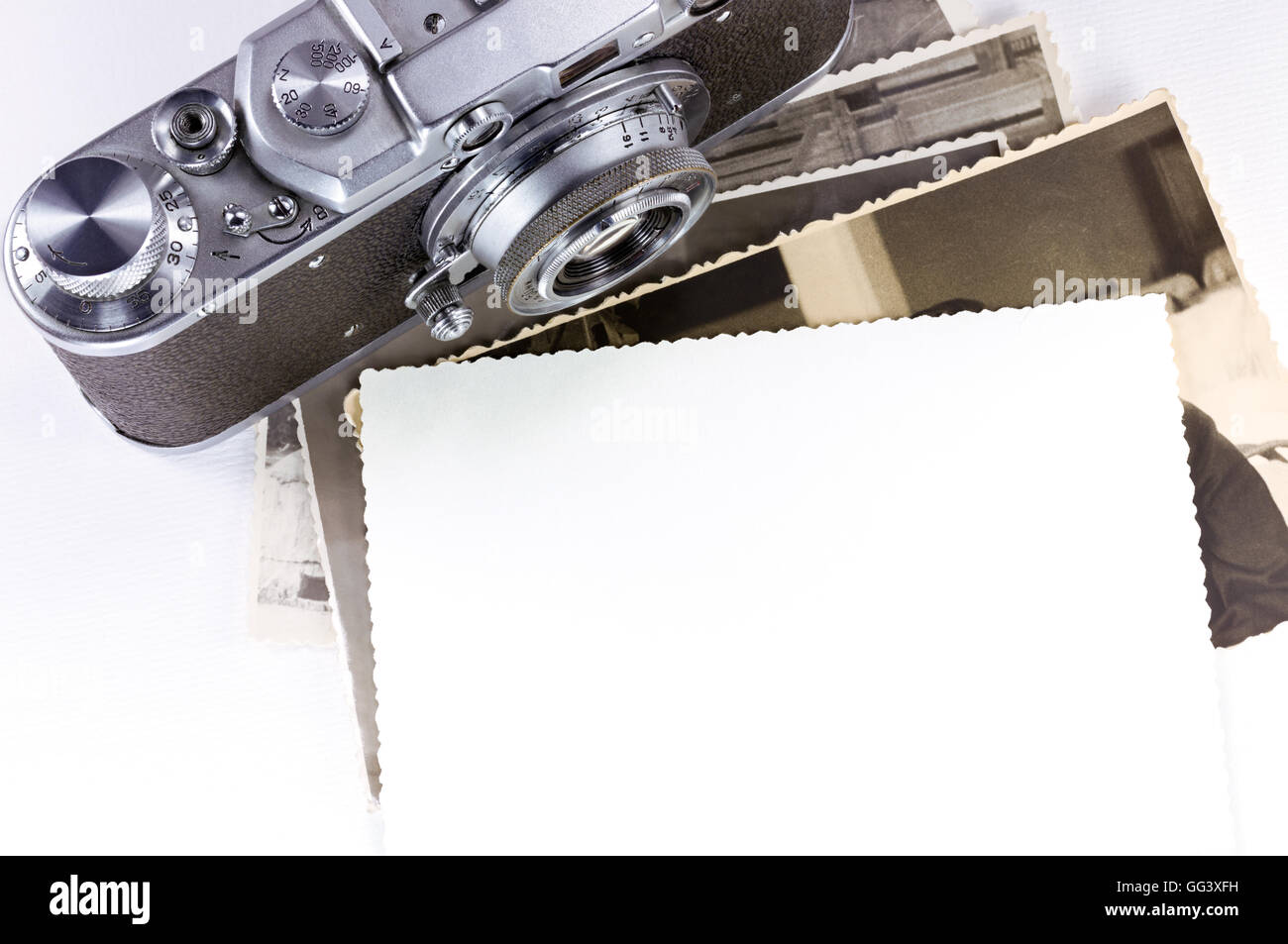 Vintage camera, photo and empty photo frame Stock Photo - Alamy