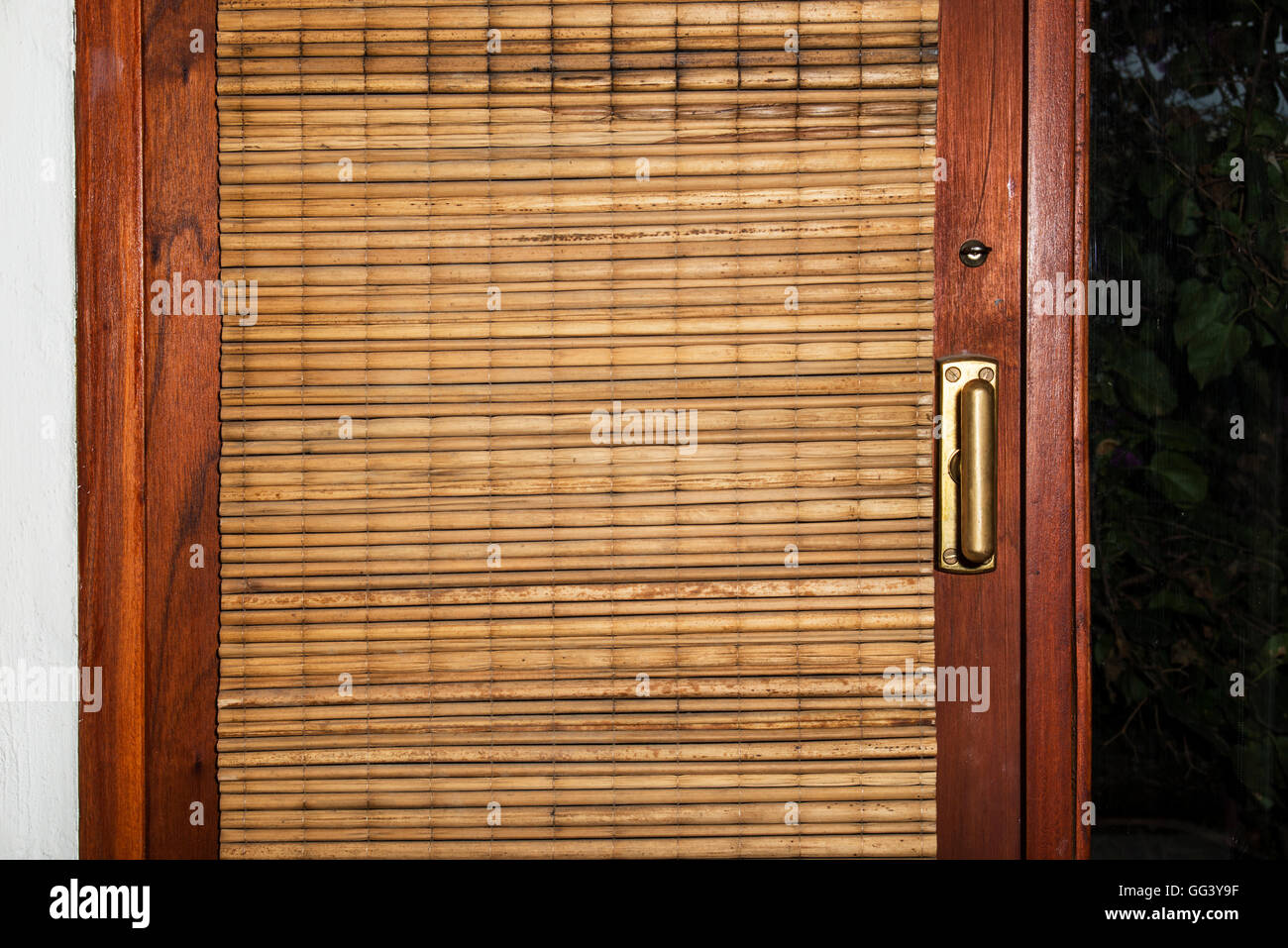 closed window mat, on one side is a wall, the other a garden Stock ...