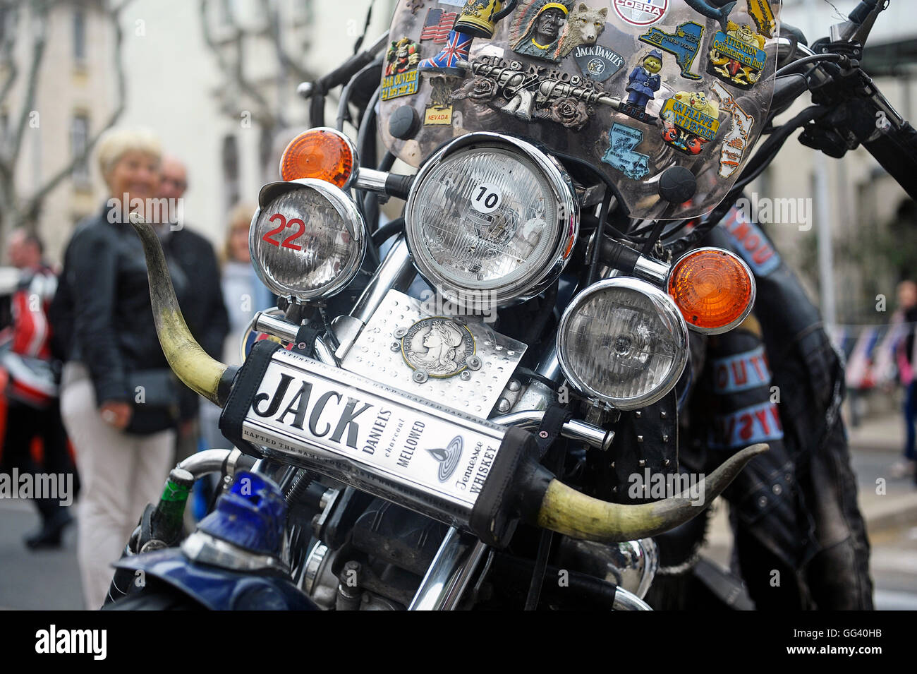 A motorcycle covered with travel memories in a gathering of American ...
