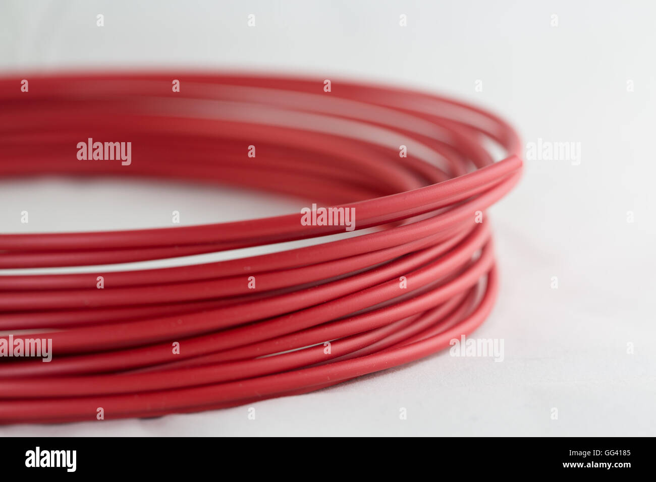 3D Printer Filament Roll in red color Stock Photo - Alamy
