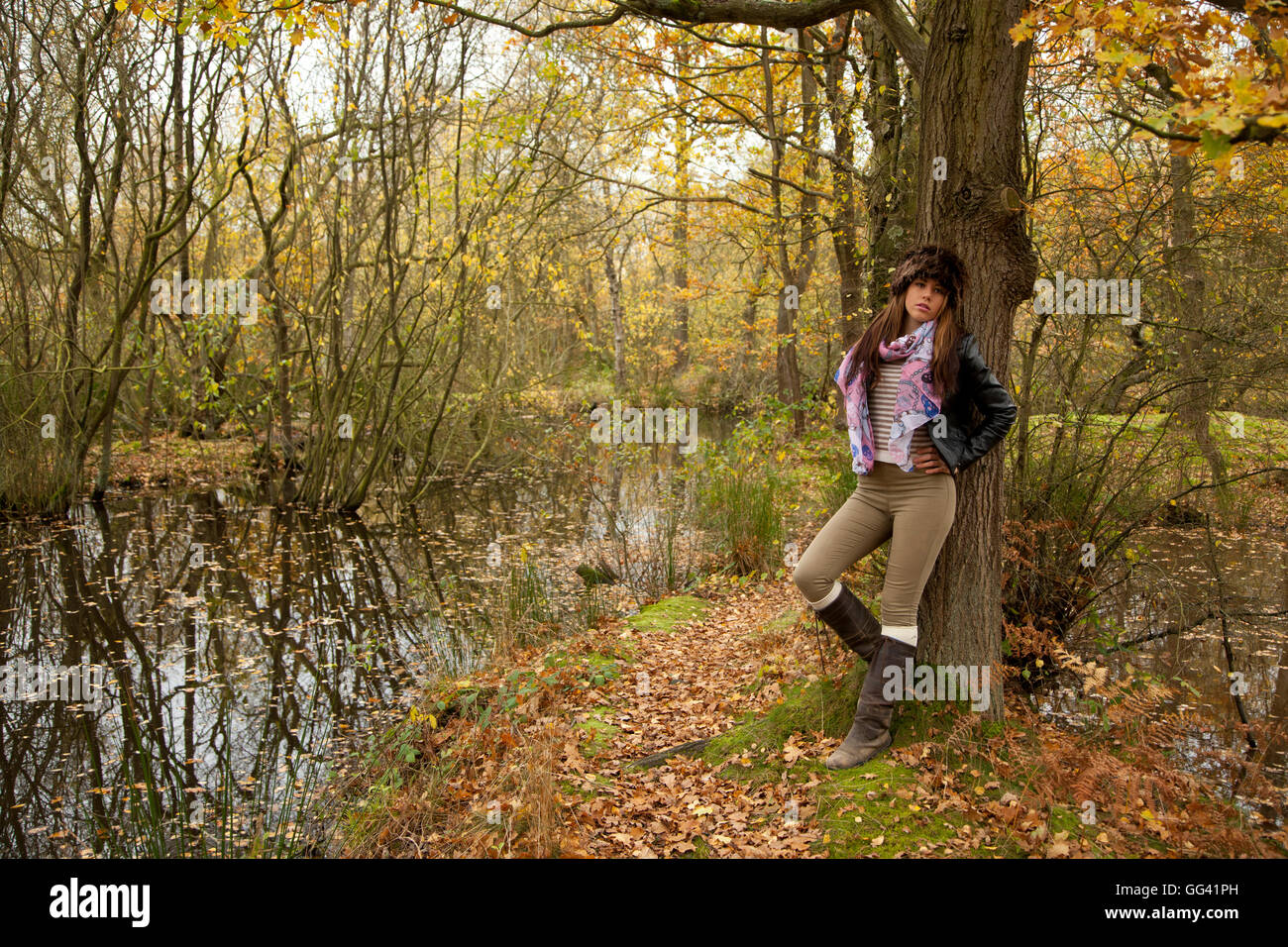 Model standing beside tree in hi-res stock photography and images - Alamy