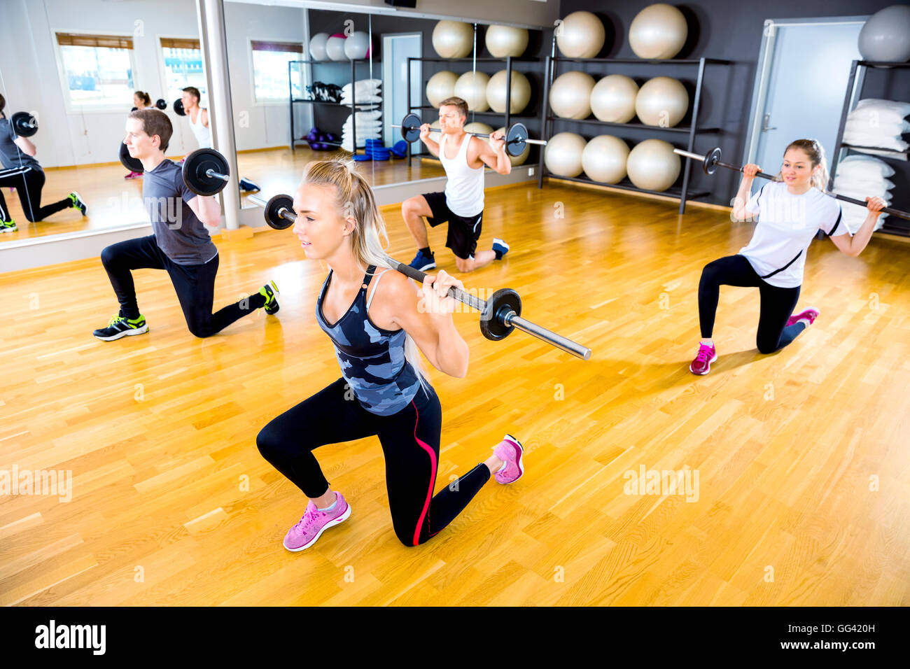 Fitness teamwork group weights hi-res stock photography and images - Alamy