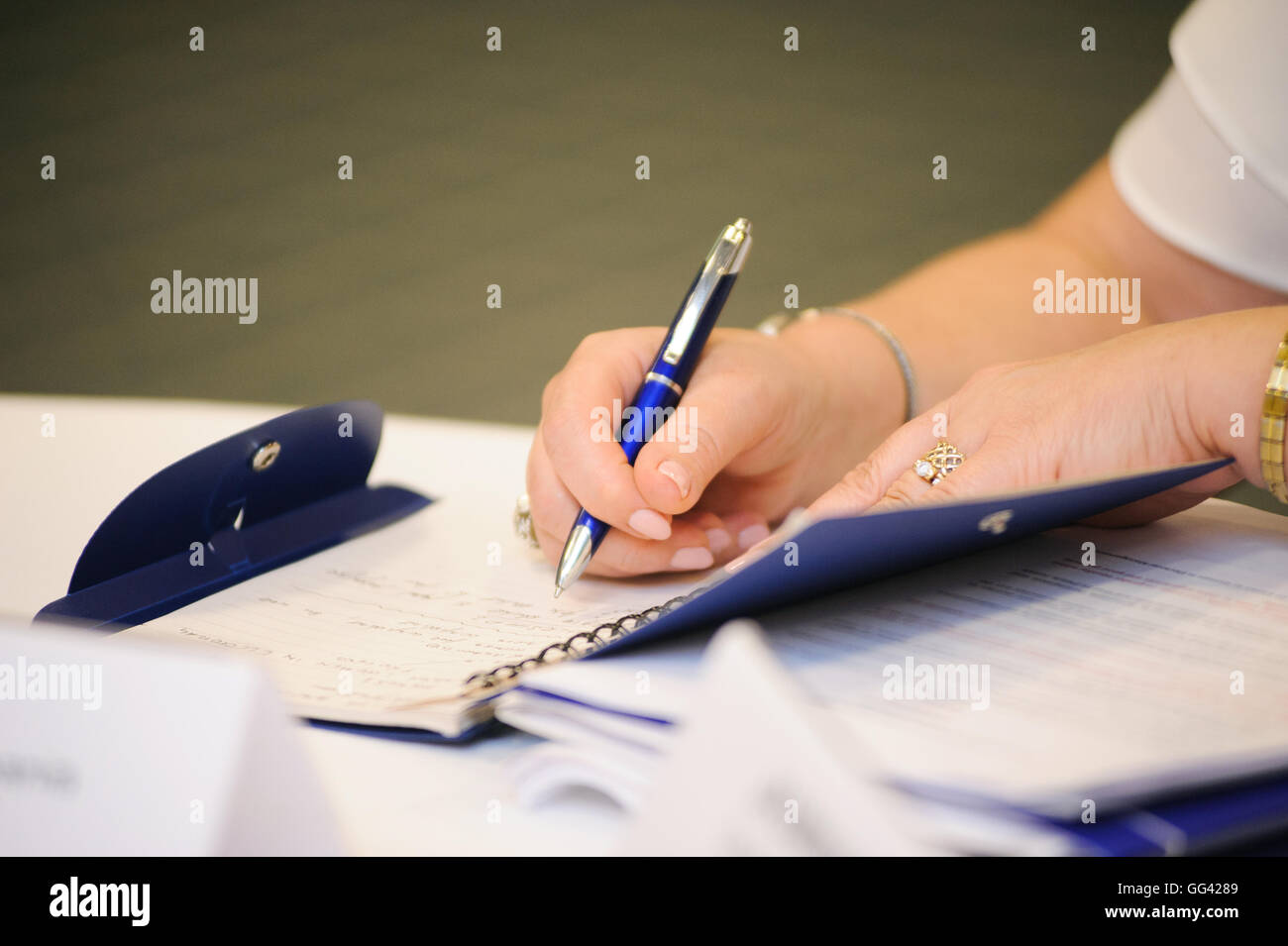 Girl writing in notepad hi-res stock photography and images - Alamy