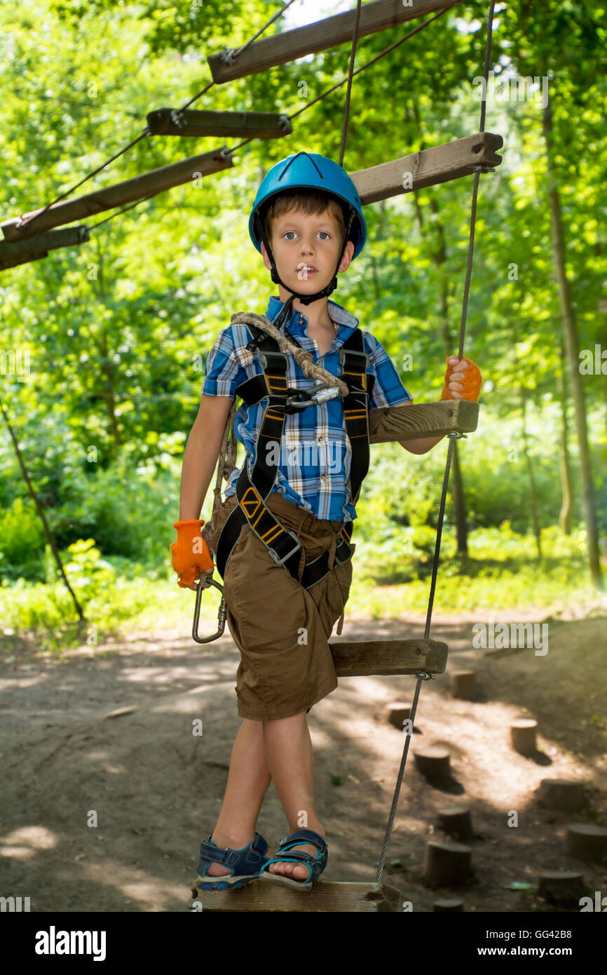 Five year boy on rope-way in forest Stock Photo - Alamy