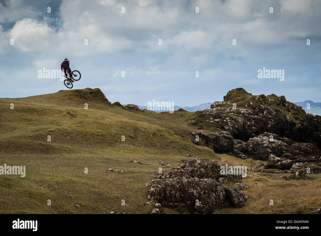 mountain bike jump in coastal landscape Stock Photo - Alamy