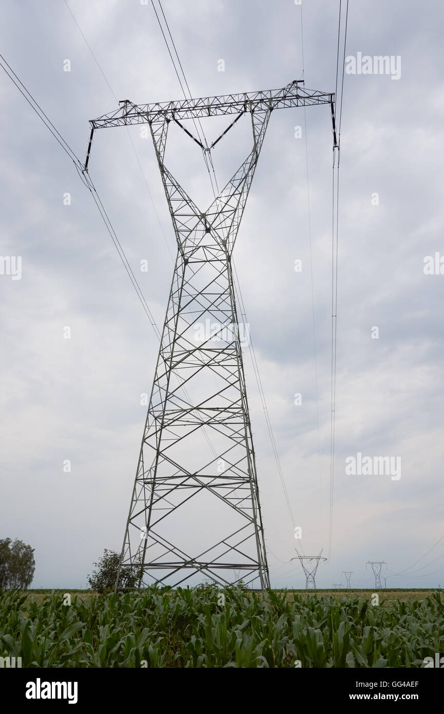 Electricity pylons spread across in countryside Stock Photo - Alamy