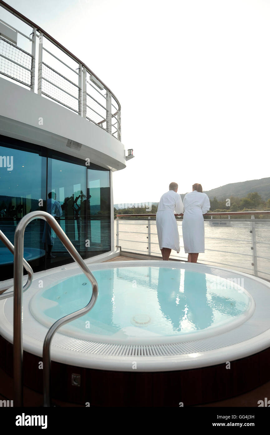 Couple on board river cruise boat with jacuzzi Stock Photo - Alamy