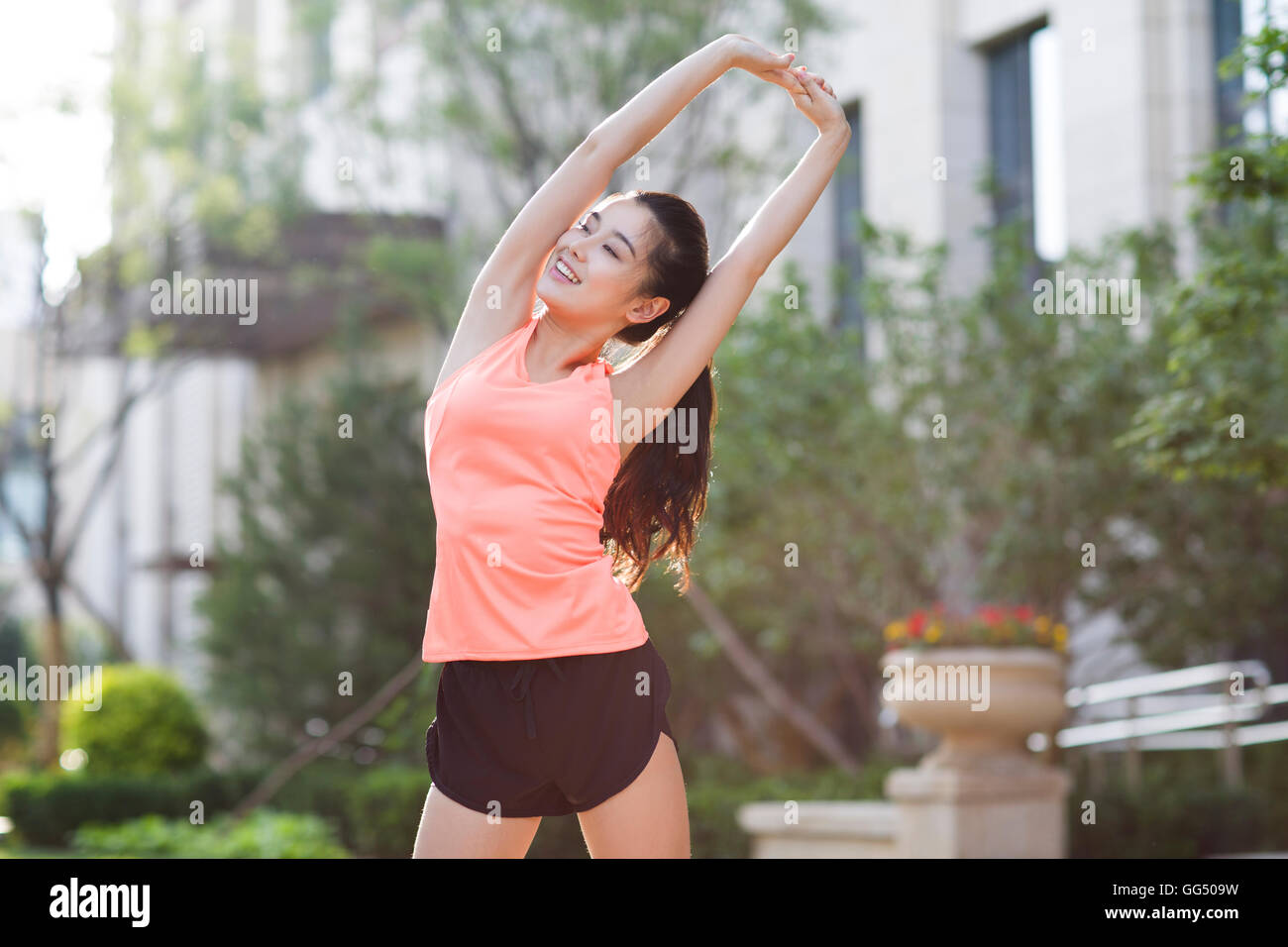 Happy young Chinese woman exercising in the morning Stock Photo - Alamy