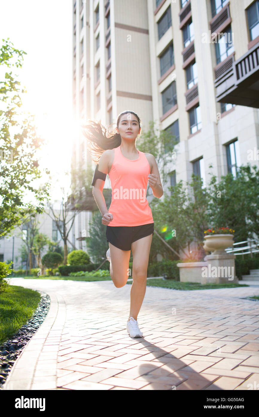 Happy young Chinese woman exercising in the morning Stock Photo - Alamy