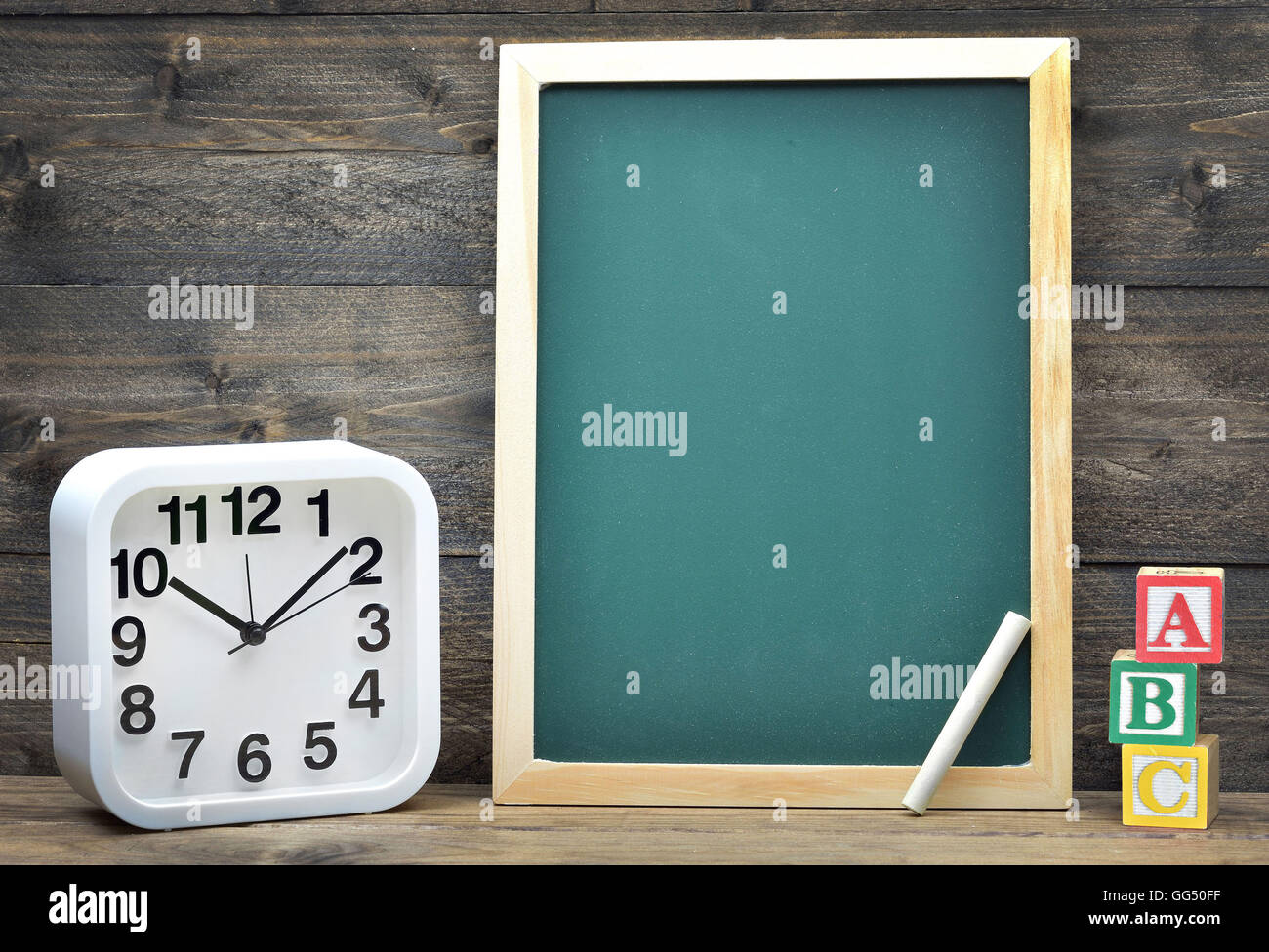 School board and word ABC on wooden table Stock Photo - Alamy