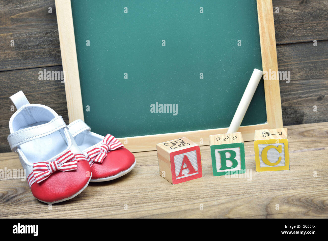 School board and word ABC on wooden table Stock Photo - Alamy