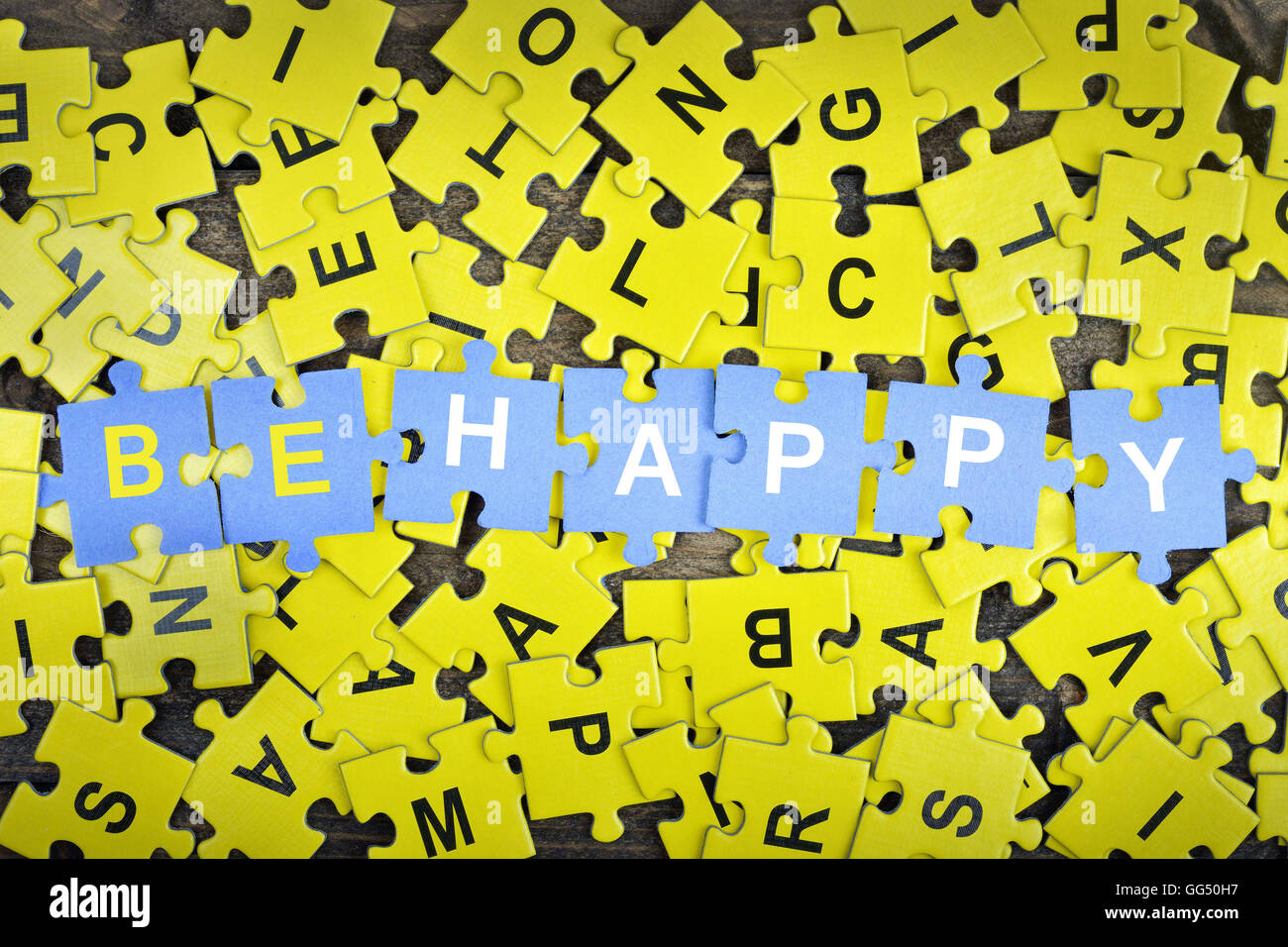 Puzzle pieces with word Be happy Stock Photo - Alamy