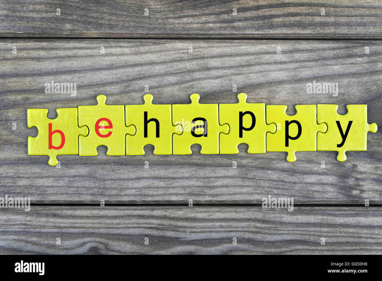 Puzzle pieces with word Be happy Stock Photo - Alamy
