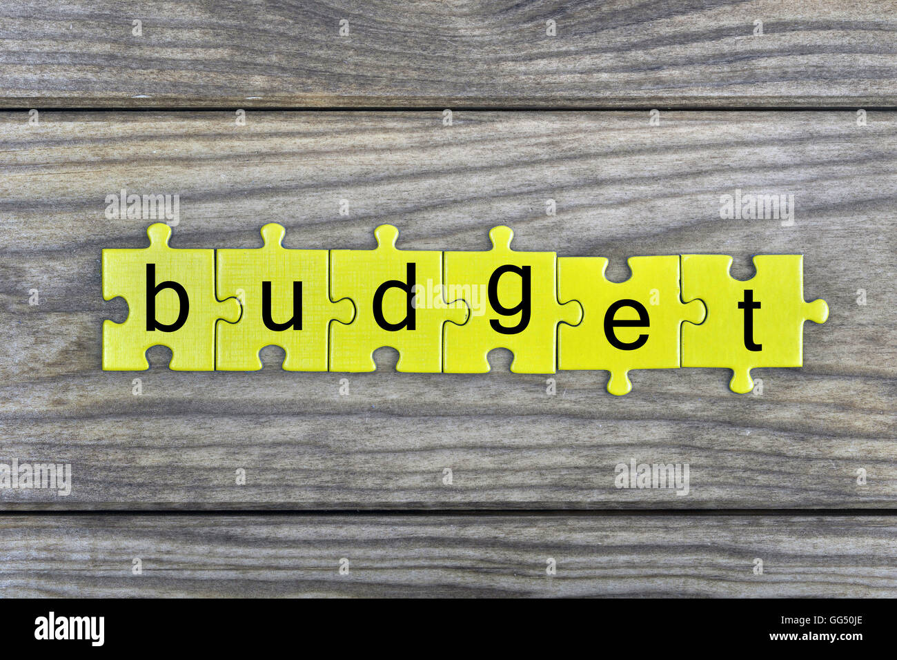 Puzzle pieces with word Budget Stock Photo - Alamy