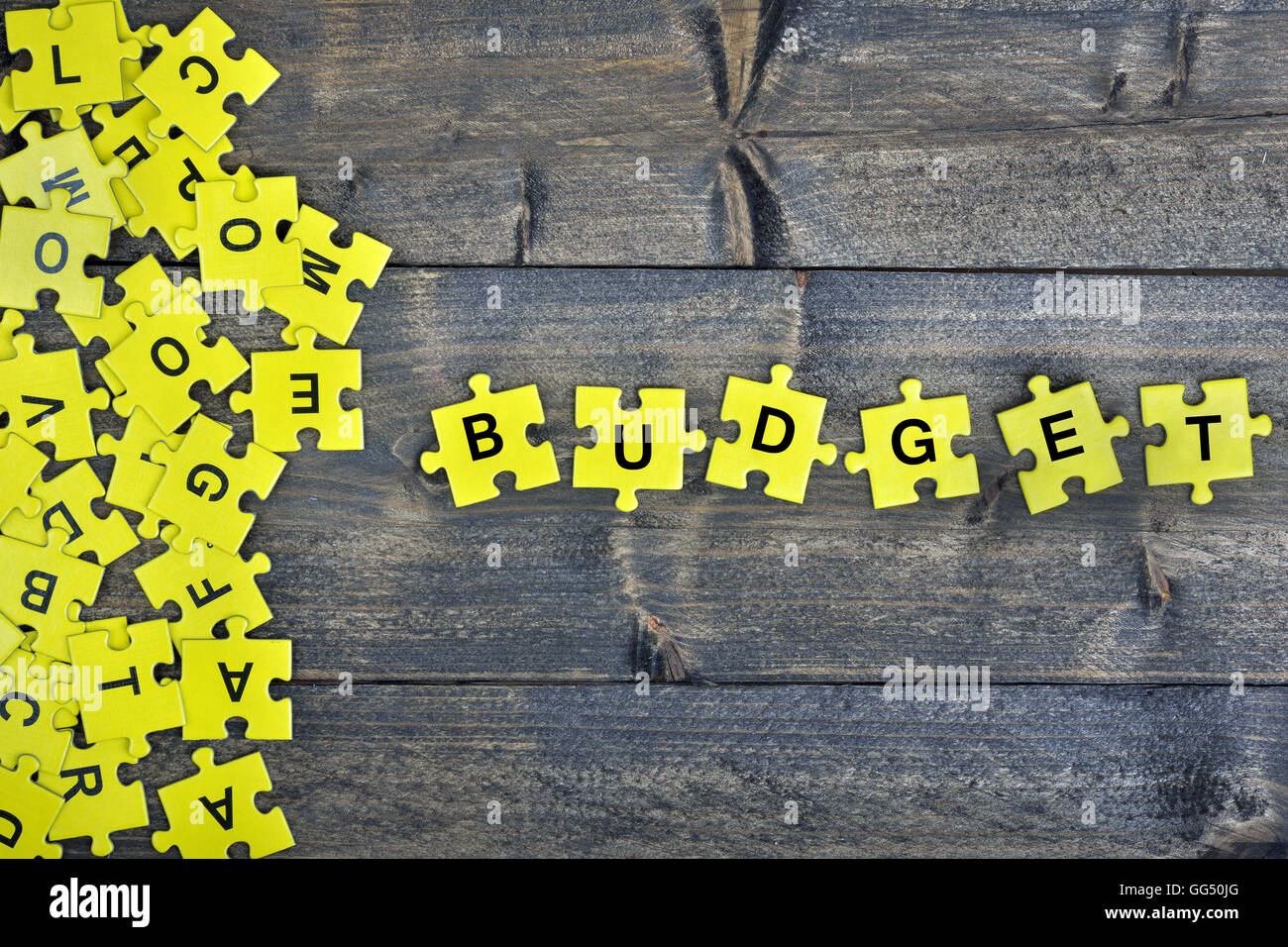 Puzzle pieces with word Budget Stock Photo - Alamy
