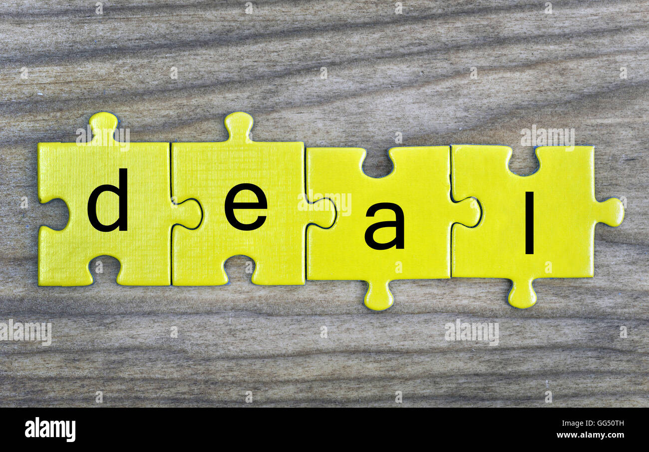 Puzzle pieces with word Deal Stock Photo - Alamy
