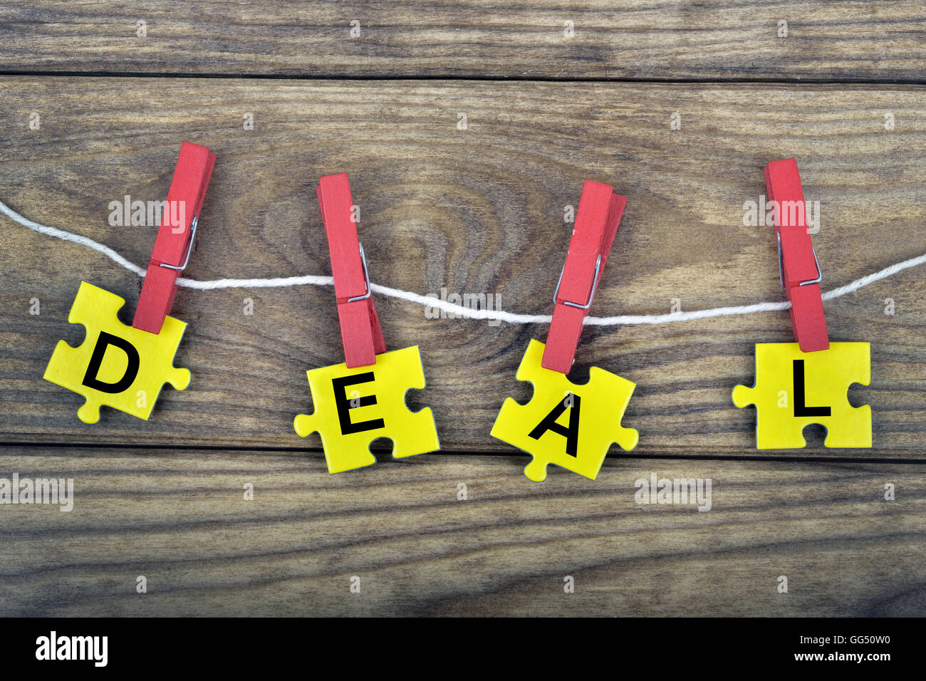 Puzzle pieces with word Deal Stock Photo - Alamy