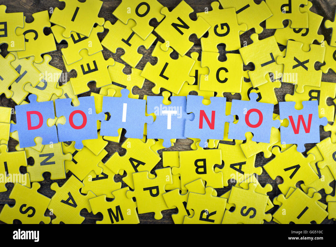 Puzzle pieces with word Do it now Stock Photo - Alamy