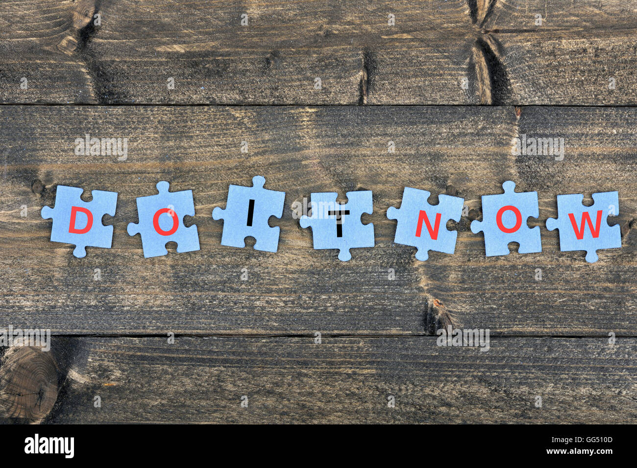 Puzzle pieces with word Do it now Stock Photo - Alamy
