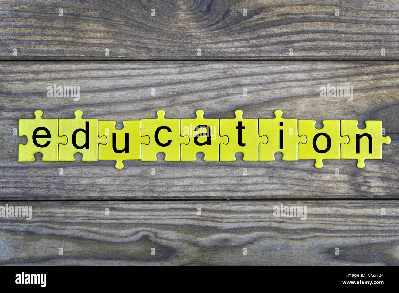 Puzzle pieces with word Education Stock Photo - Alamy