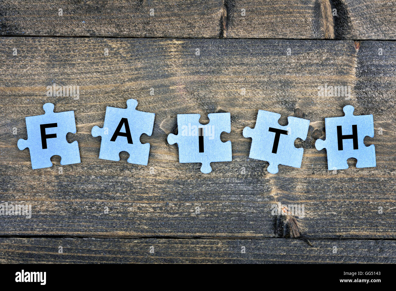 Puzzle pieces with word Faith Stock Photo - Alamy