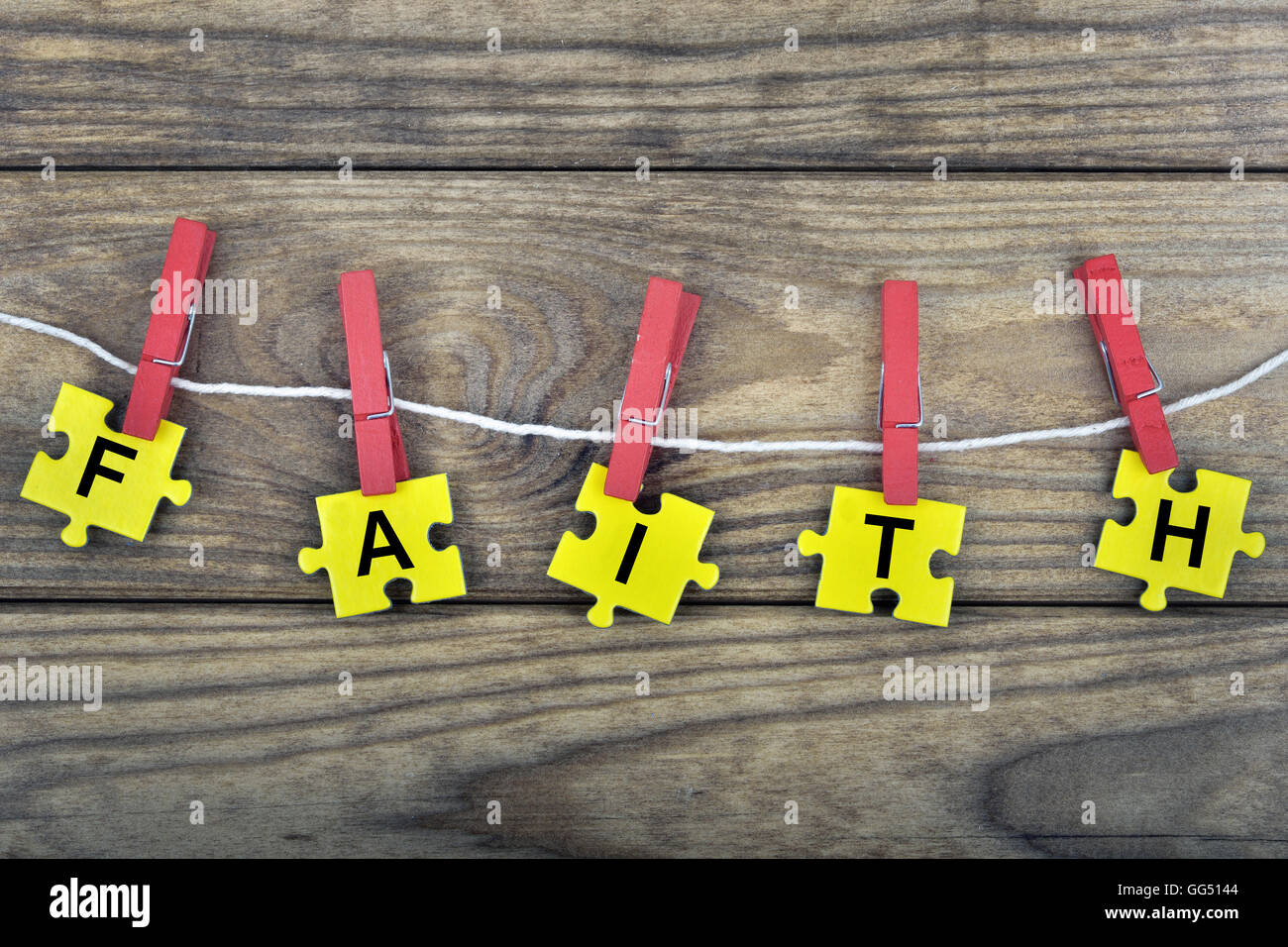 Puzzle pieces with word Faith Stock Photo - Alamy