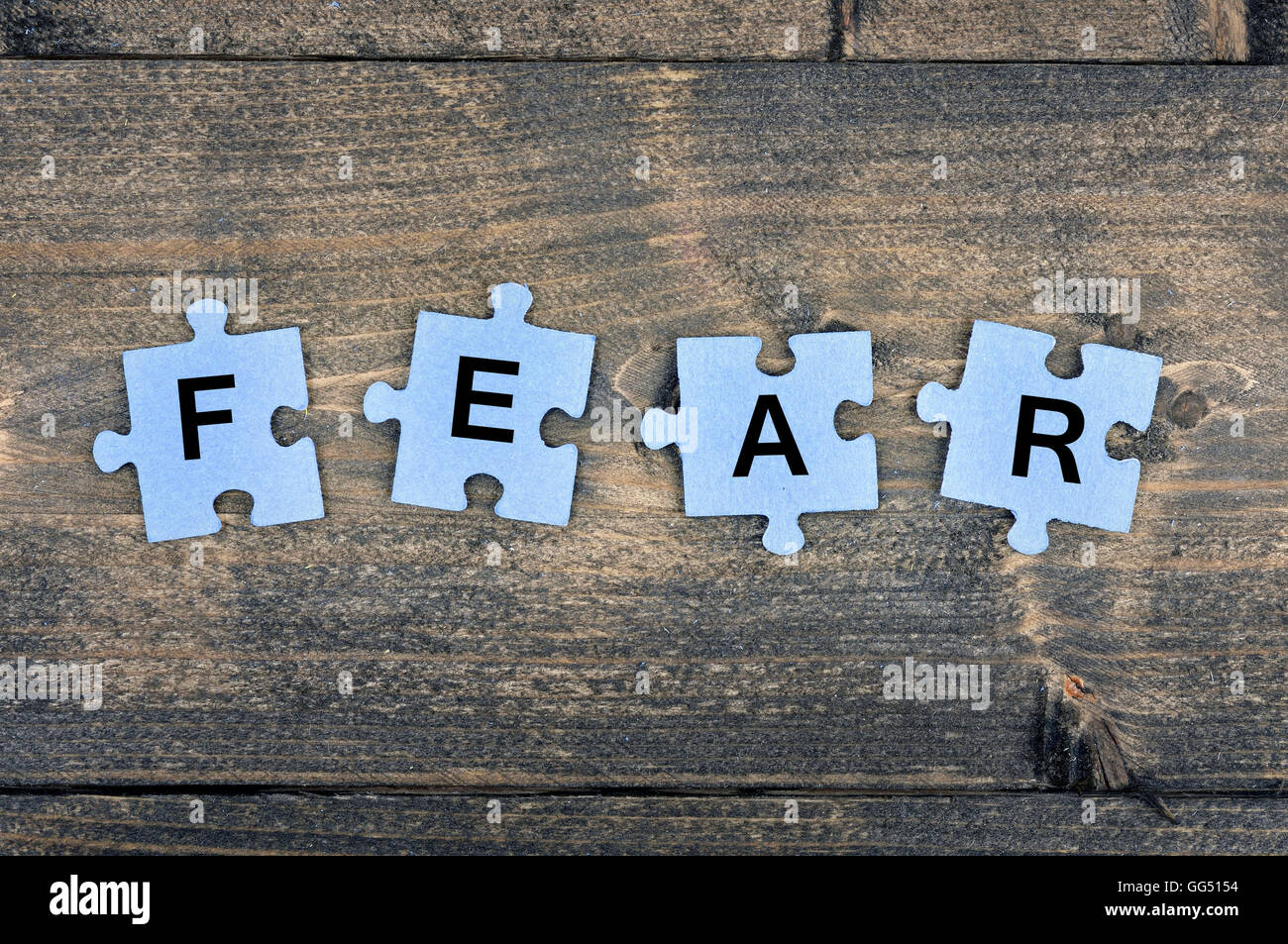 Puzzle pieces with word Fear Stock Photo - Alamy