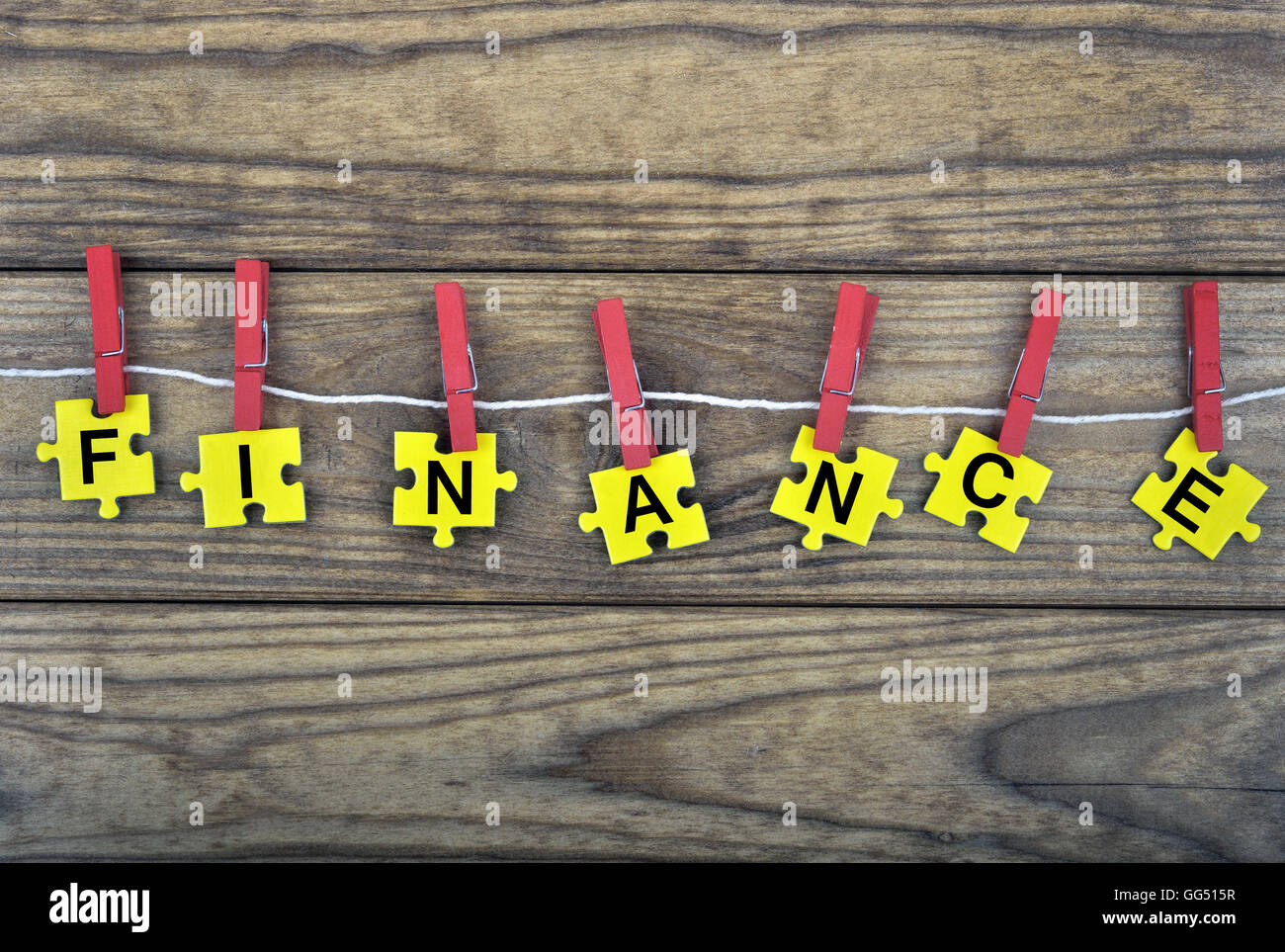 Puzzle pieces with word Finance Stock Photo - Alamy