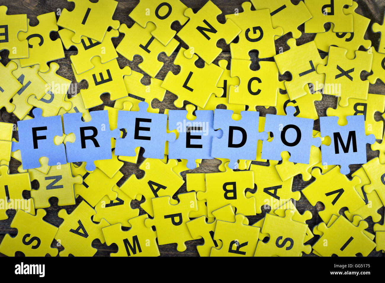 Puzzle pieces with word Freedom Stock Photo - Alamy