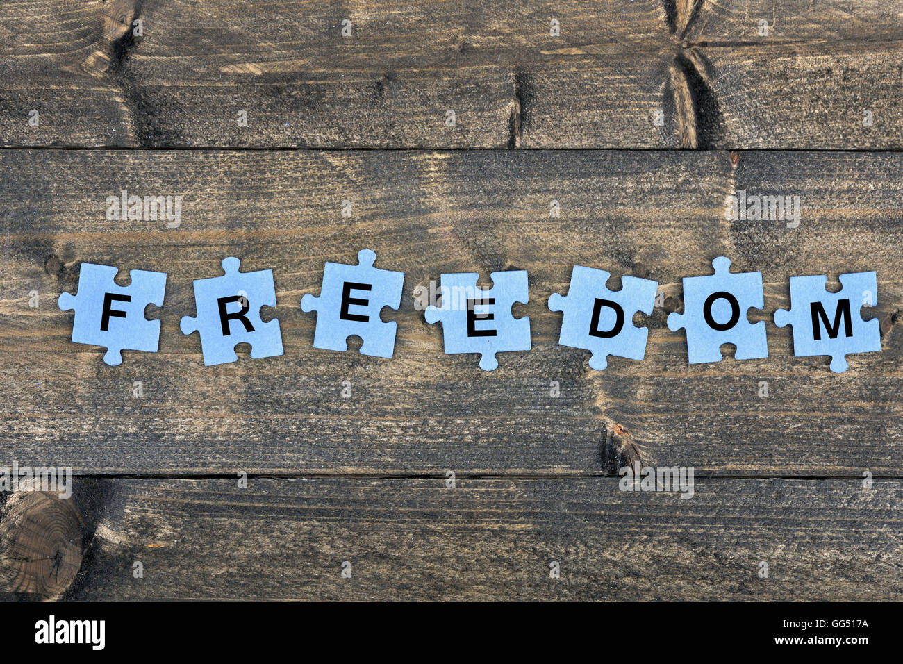 Puzzle pieces with word Freedom Stock Photo - Alamy