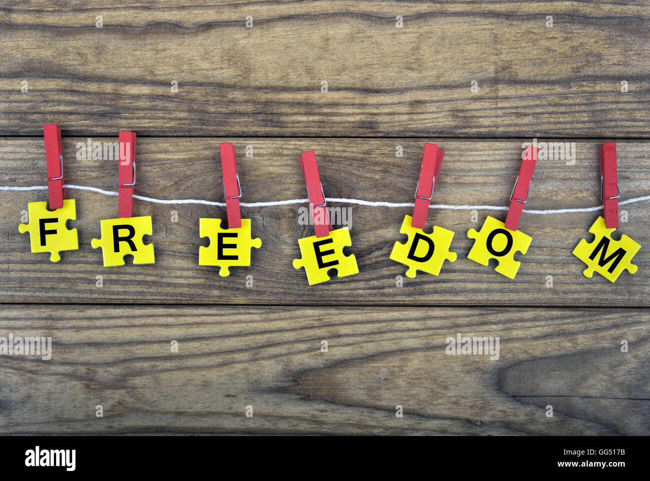 Puzzle pieces with word Freedom Stock Photo - Alamy