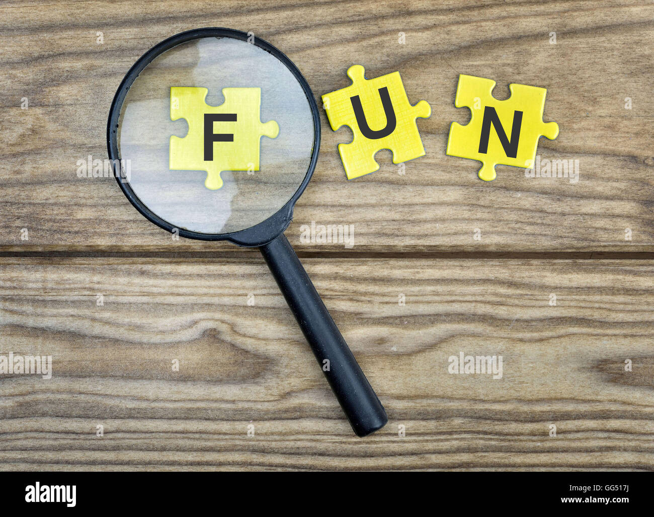 Puzzle pieces with word Fun Stock Photo - Alamy