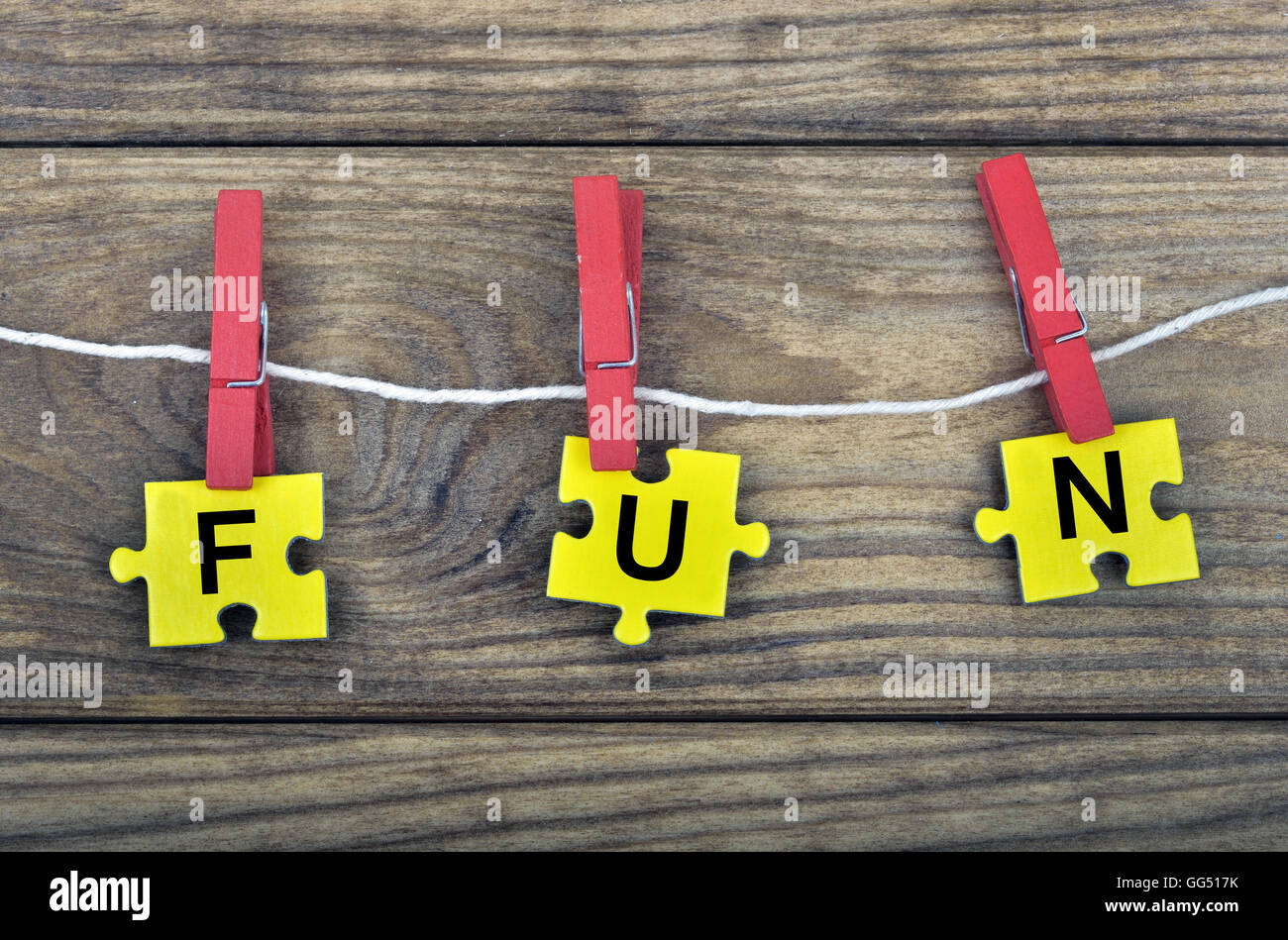 Puzzle pieces with word Fun Stock Photo - Alamy