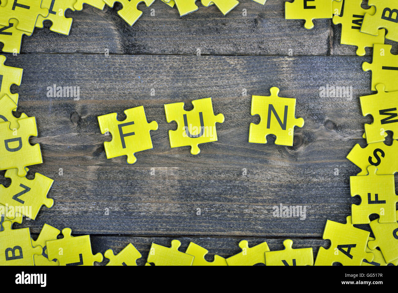 Puzzle pieces with word Fun Stock Photo - Alamy