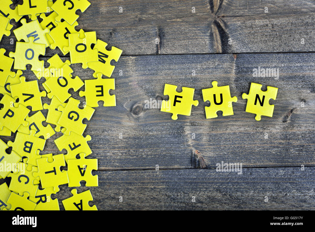 Puzzle pieces with word Fun Stock Photo - Alamy