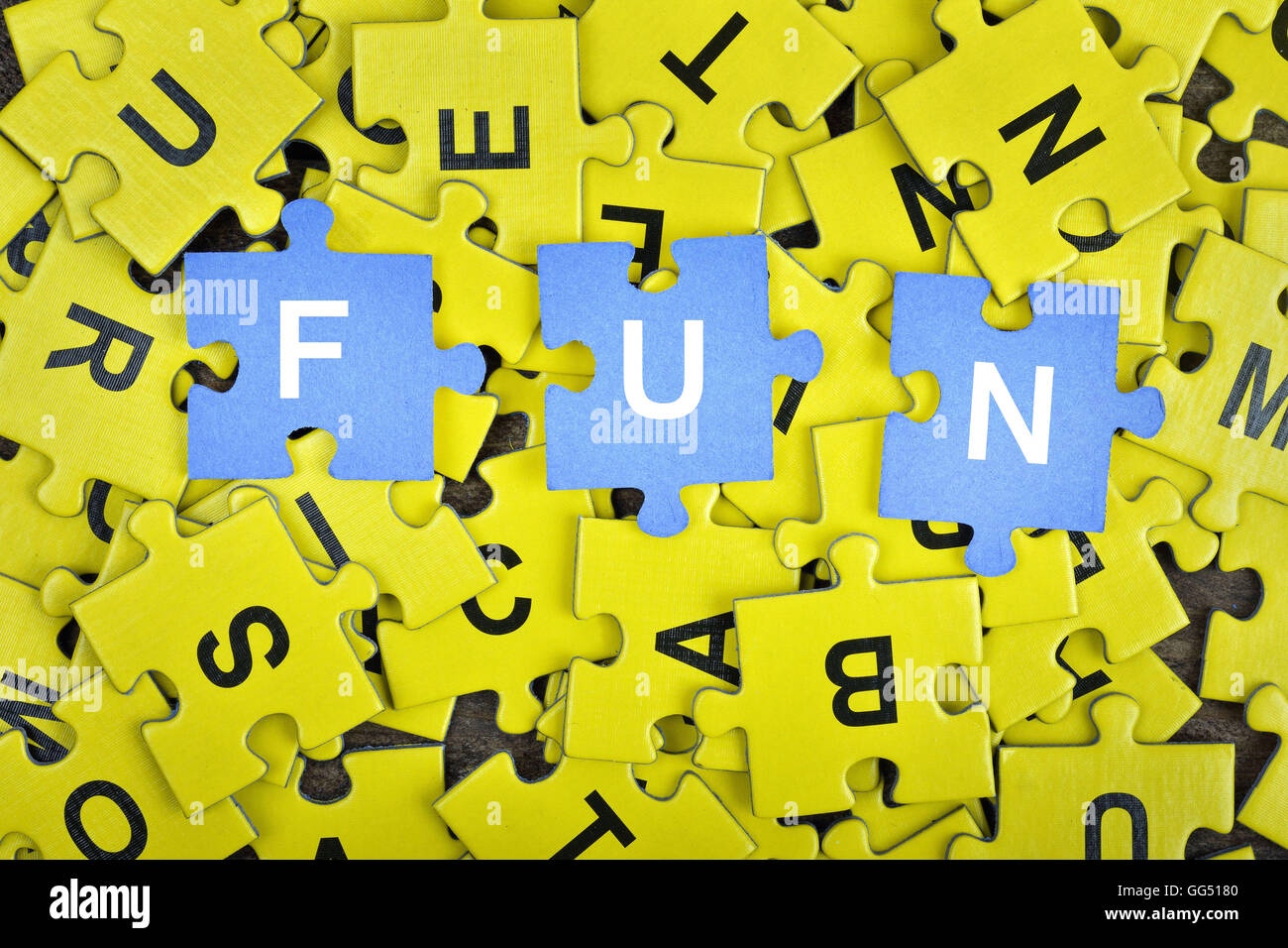 Puzzle pieces with word Fun Stock Photo - Alamy