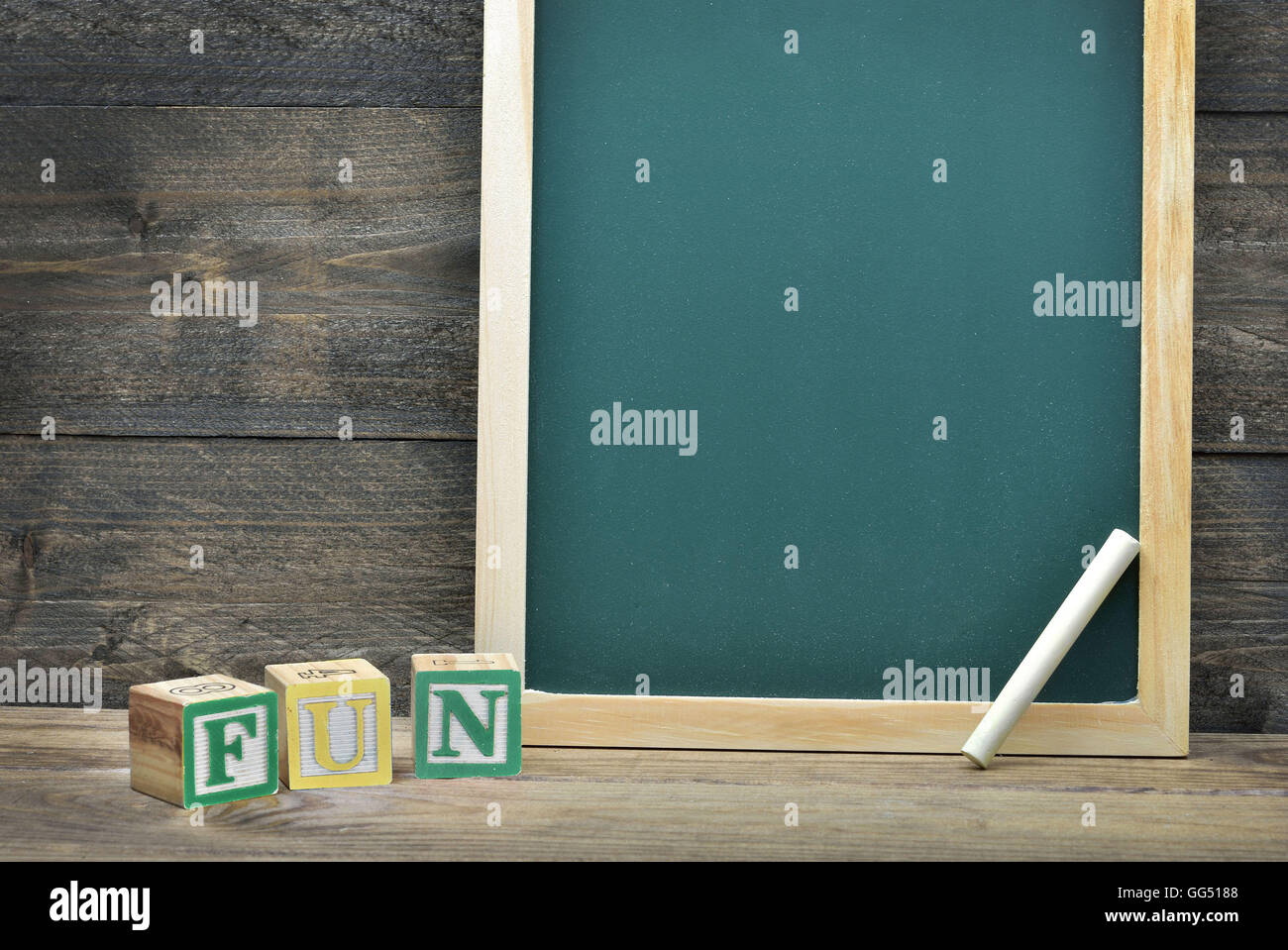 School board and word Fun on wooden table Stock Photo - Alamy