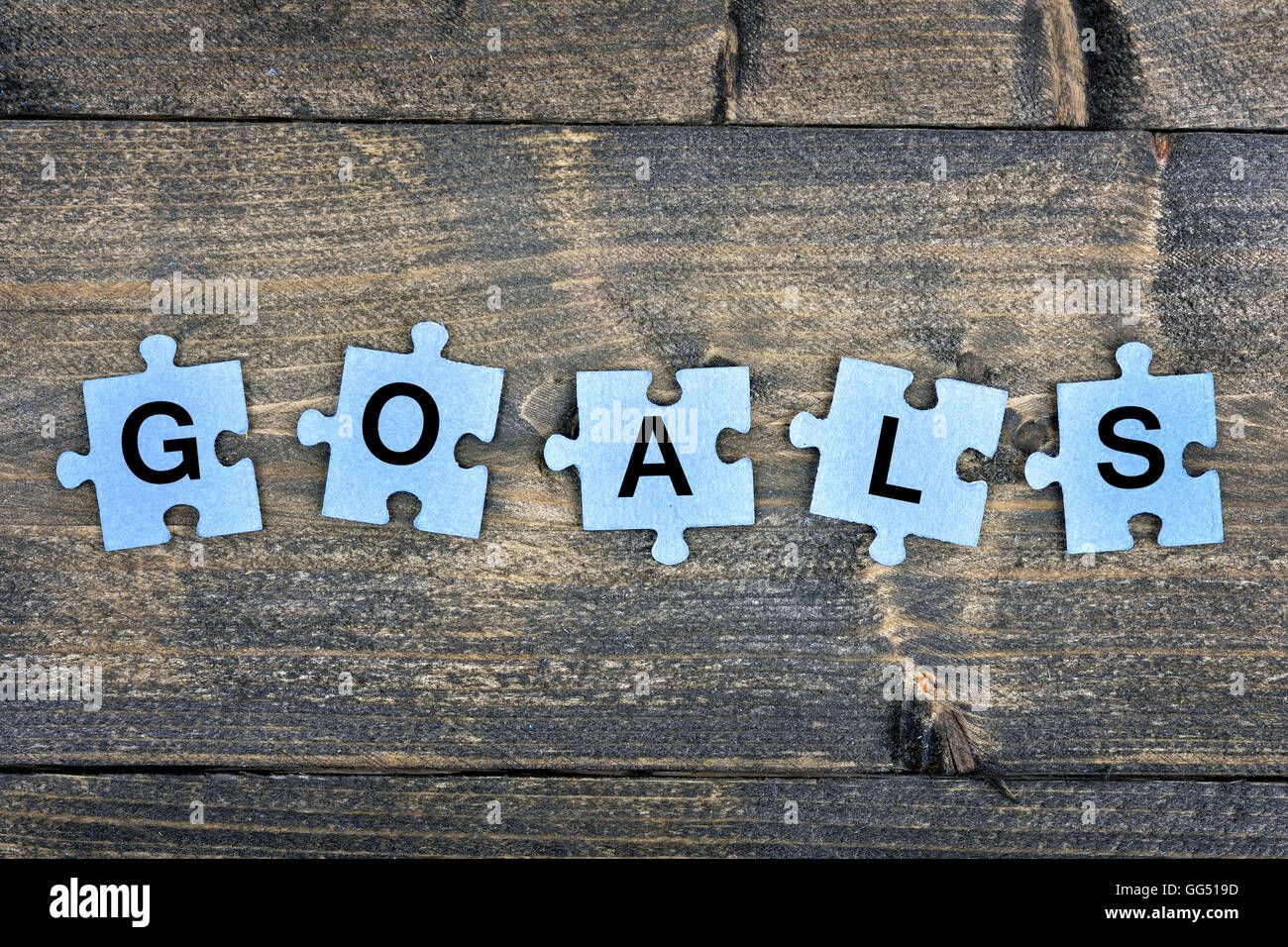 Puzzle pieces with word Goals Stock Photo - Alamy