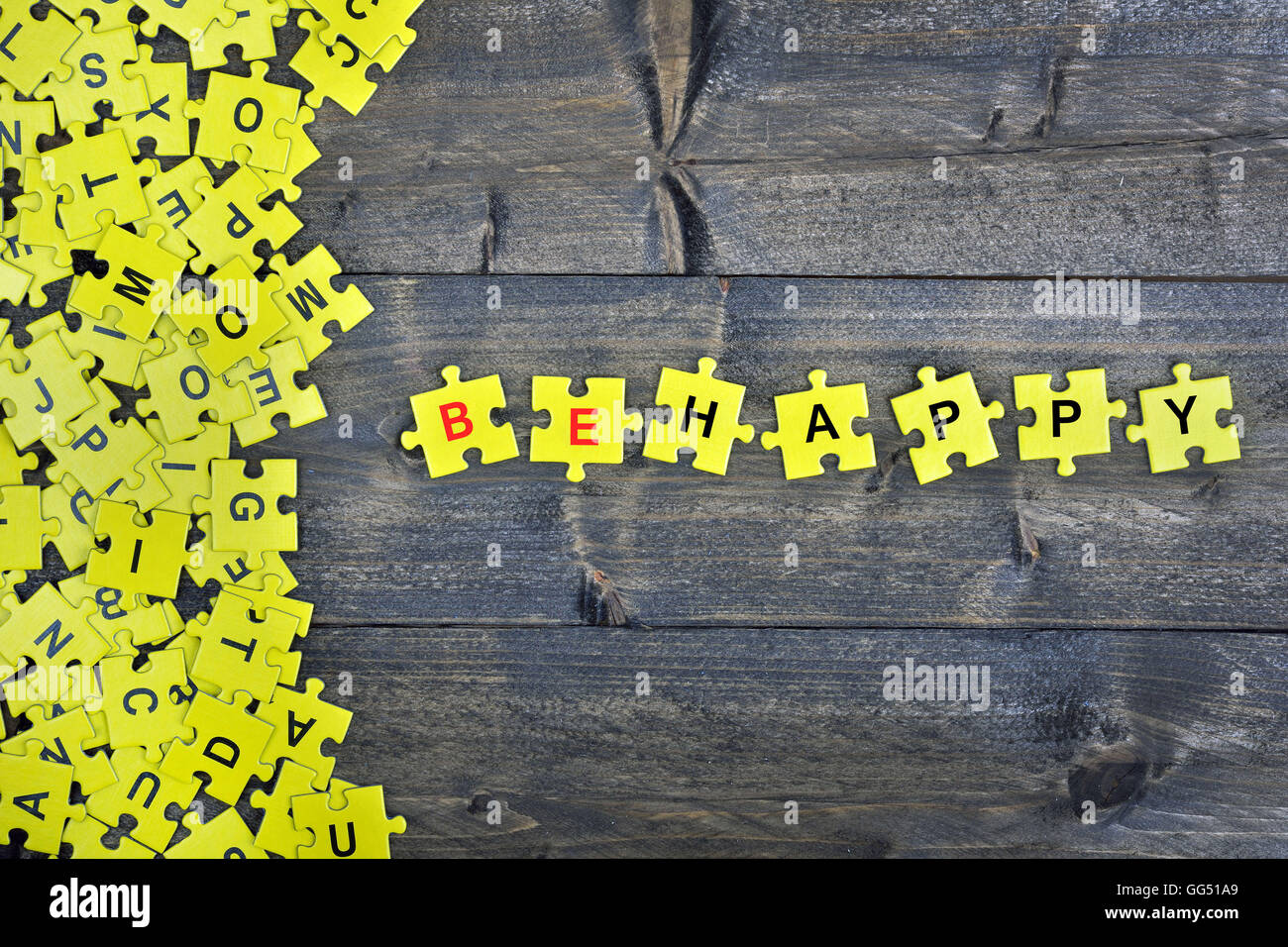 Puzzle pieces with word Be happy Stock Photo - Alamy