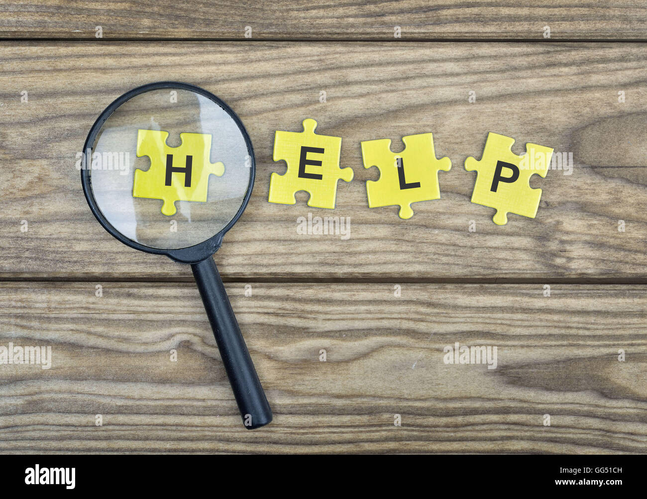 Puzzle pieces with word Help Stock Photo - Alamy